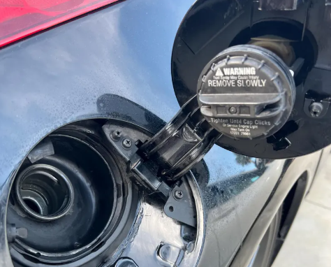 That Plastic Tab Inside Your Fuel Door Has a Job Most Drivers Ignore